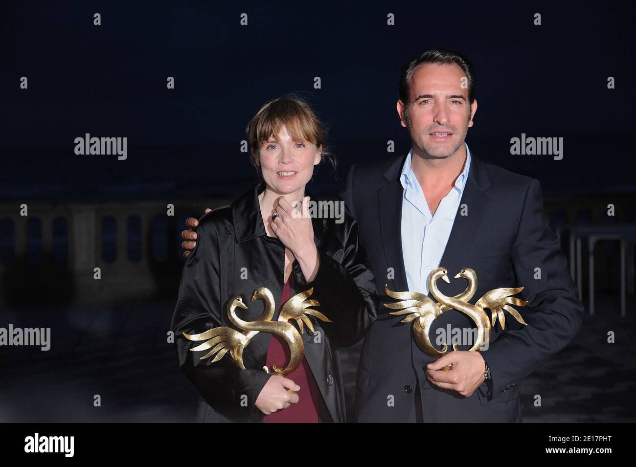 Isabelle Carre and Jean Dujardin pose with the Golden Swan of Best ...
