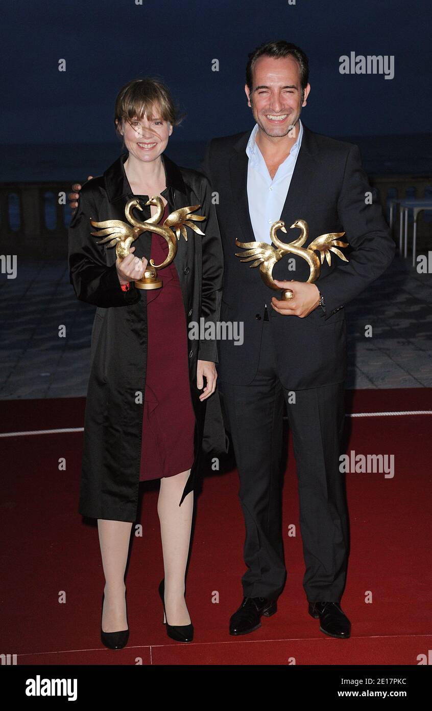 Isabelle Carre and Jean Dujardin pose with the Golden Swan of Best ...