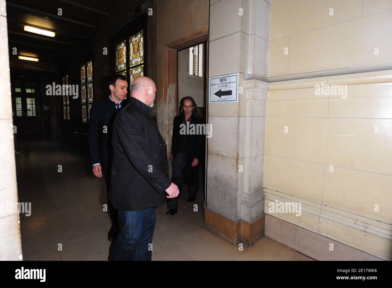 British fashion designer John Galliano and friend Alexis Roche arrive ...