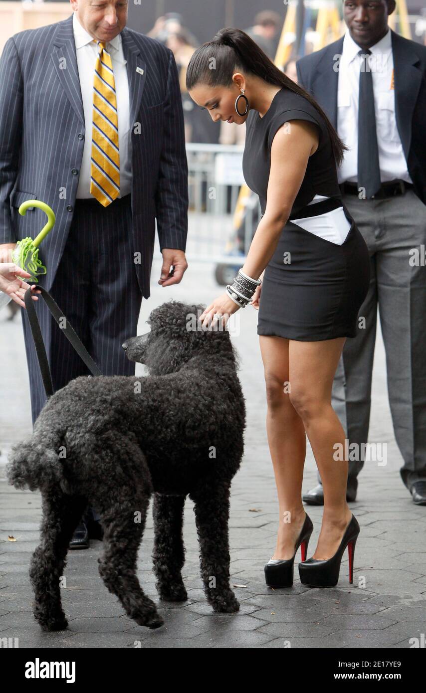 U.S personnality Kim Kardashian posing with a dog and some park rangers ...