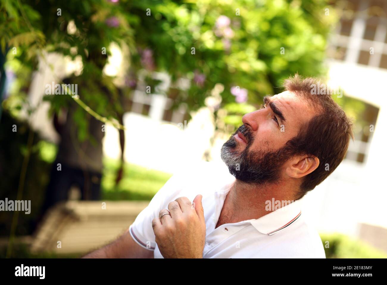French actor Eric Cantona poses ahead of the screening of his latest ...