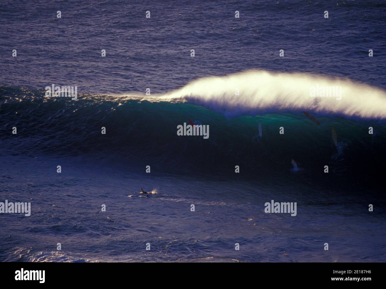 Surfers trying to escape a huge rogue wave at Waimea Bay, North Shore ...