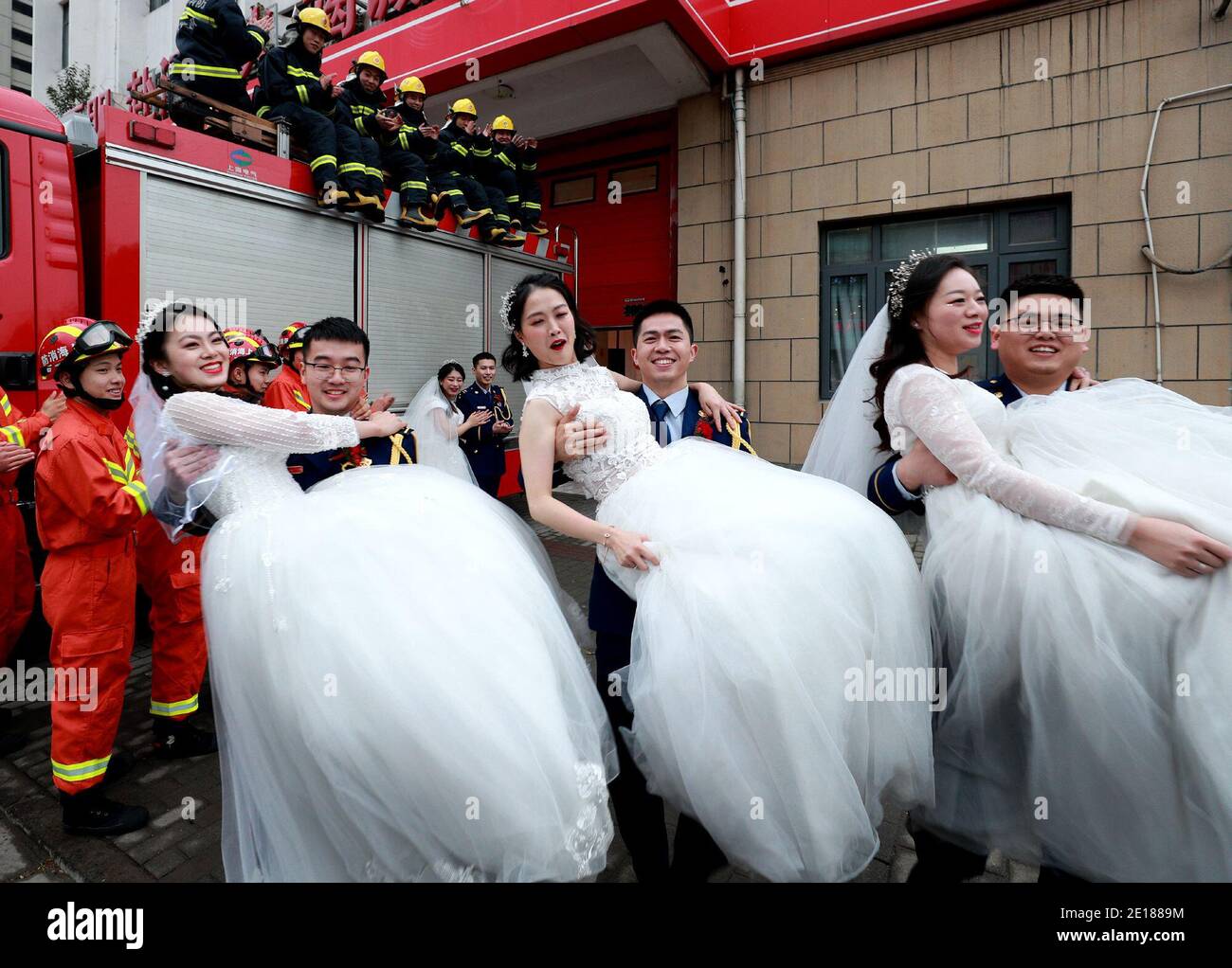 Shanghai. 4th Jan, 2021. Firefighters and their wives attend a group ...