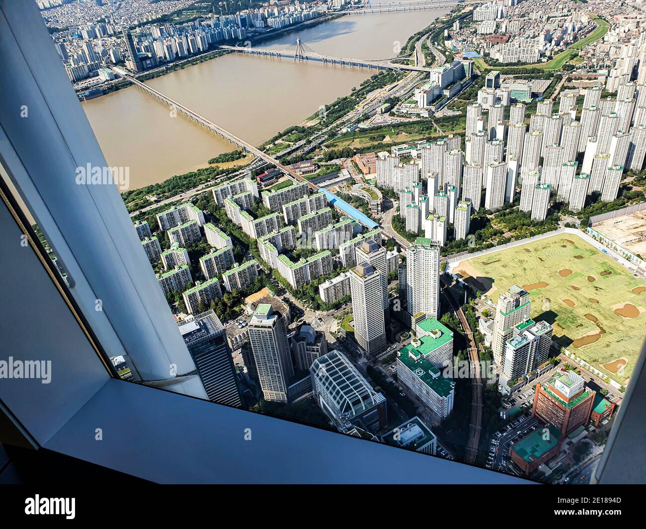 View of the apartment and river from the high observation deck window ...