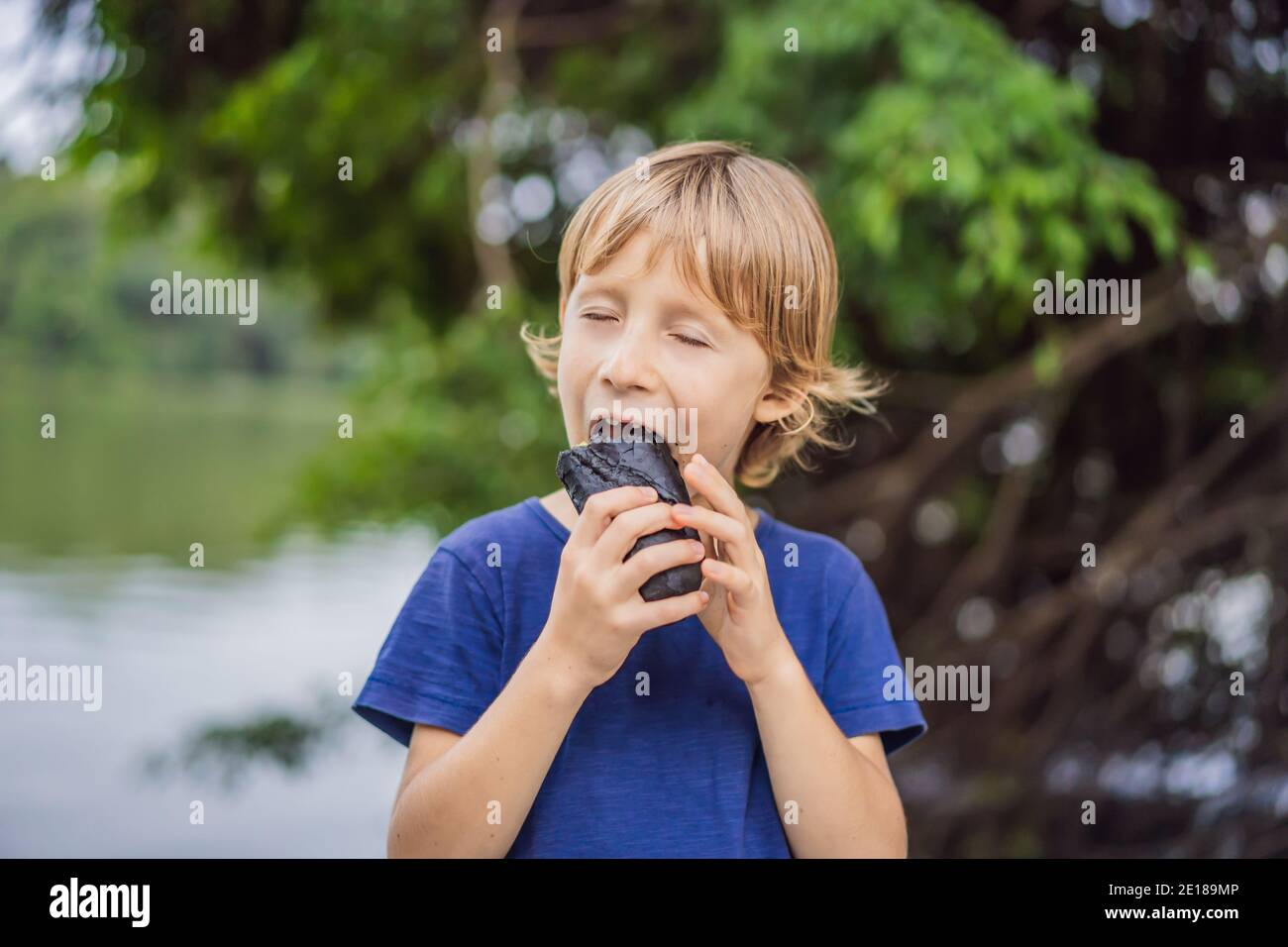 Boy eating ham burger hi-res stock photography and images - Alamy