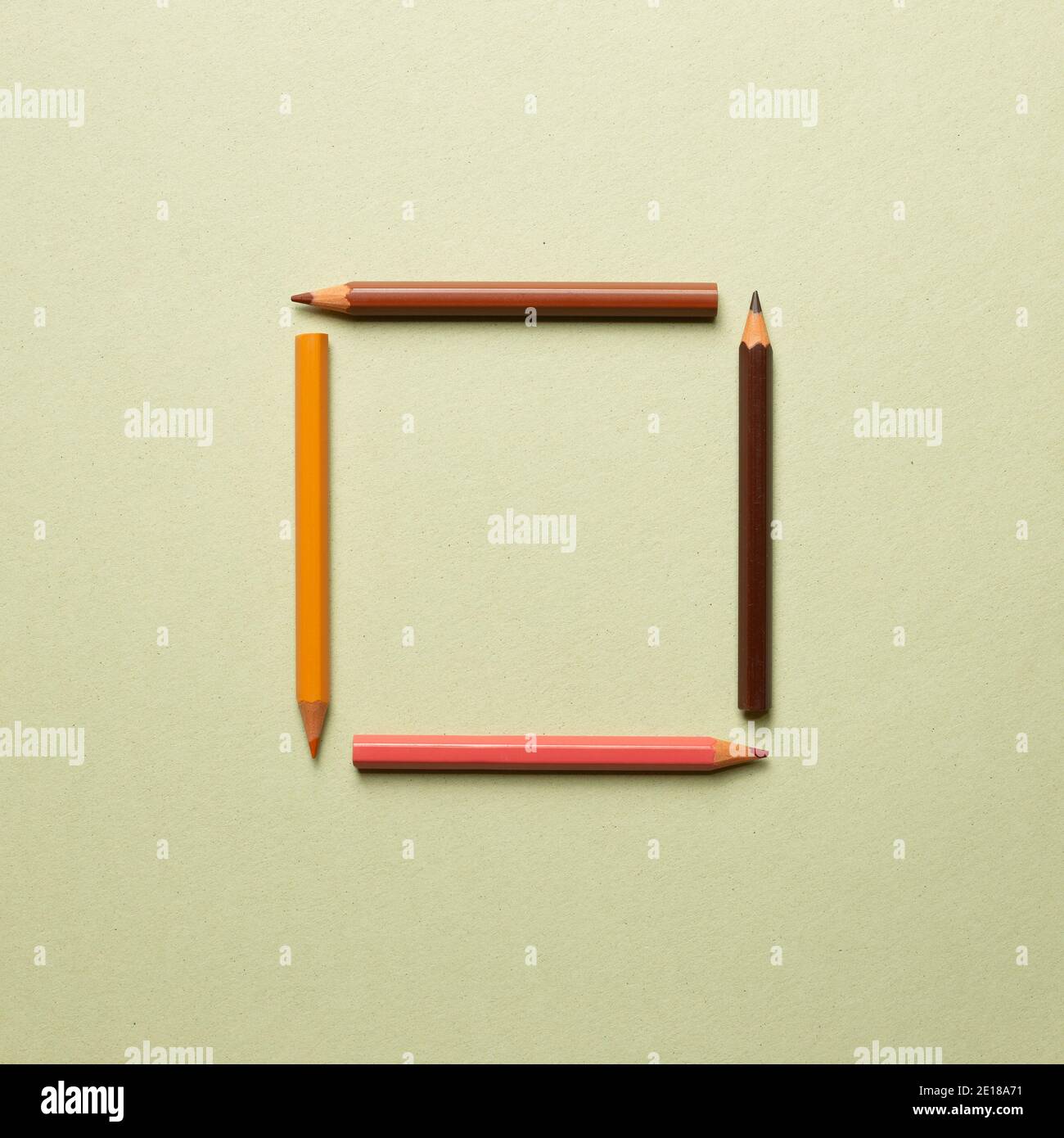 Colored pencils on khaki background. flat lay, top view, copy space ...