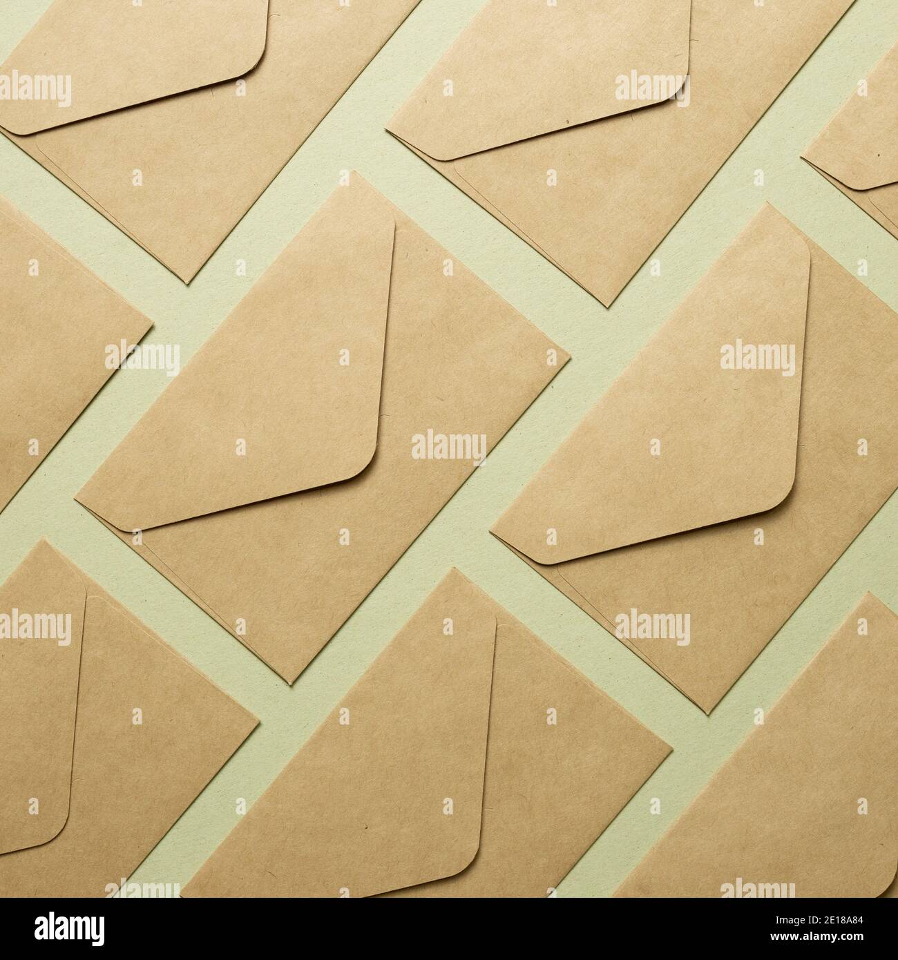 Kraft brown paper envelopes on khaki background. top view, copy space ...
