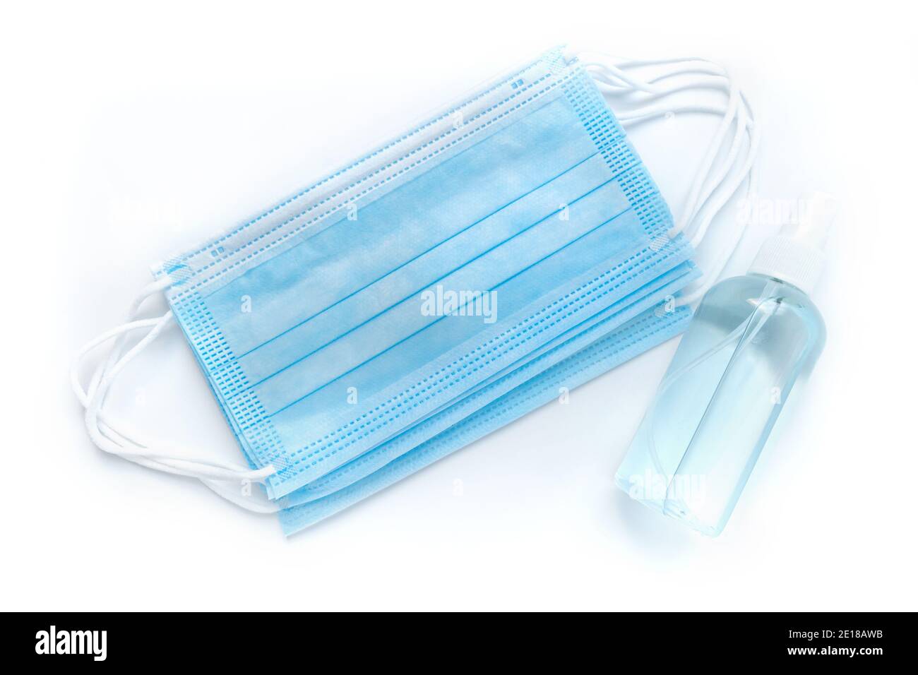 Medical protective mask and hand sanitizer gel isolated on white ...