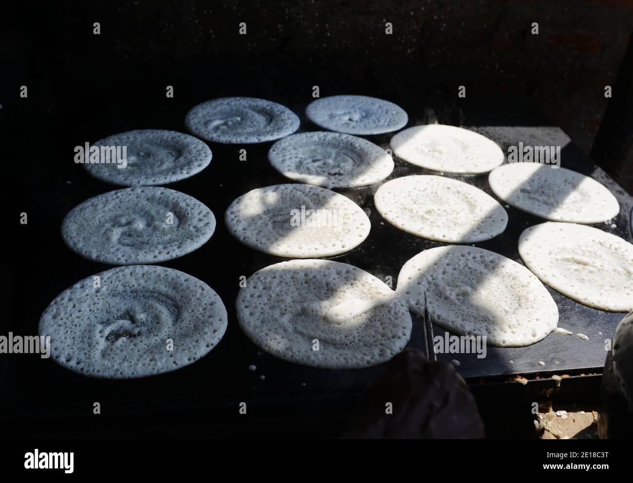 A Tamil cook preparing a Dosa Stock Photo - Alamy