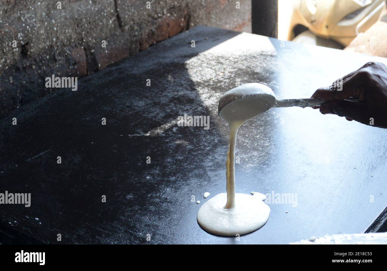 A Tamil cook preparing a Dosa Stock Photo - Alamy