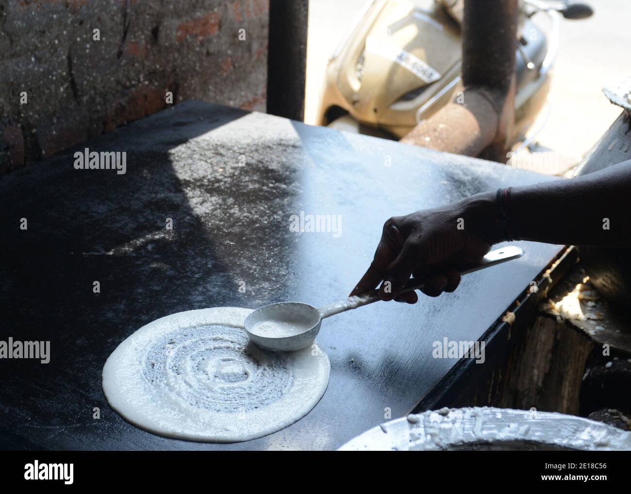 A Tamil cook preparing a Dosa Stock Photo - Alamy