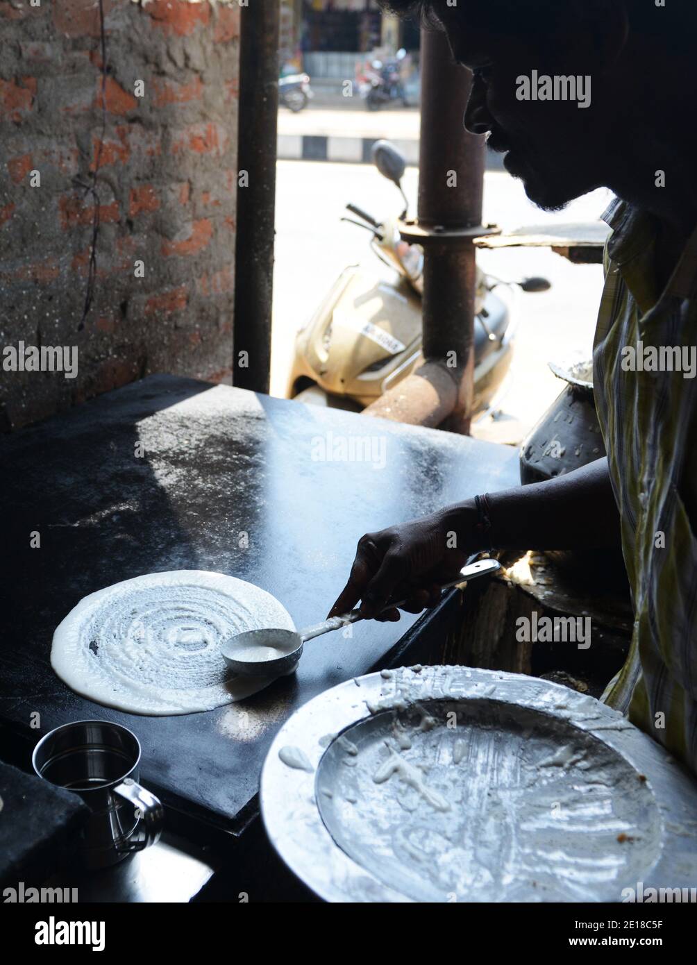 A Tamil cook preparing a Dosa Stock Photo - Alamy