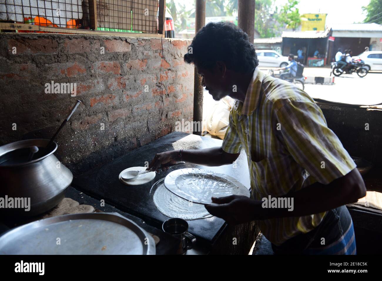 A Tamil cook preparing a Dosa Stock Photo - Alamy