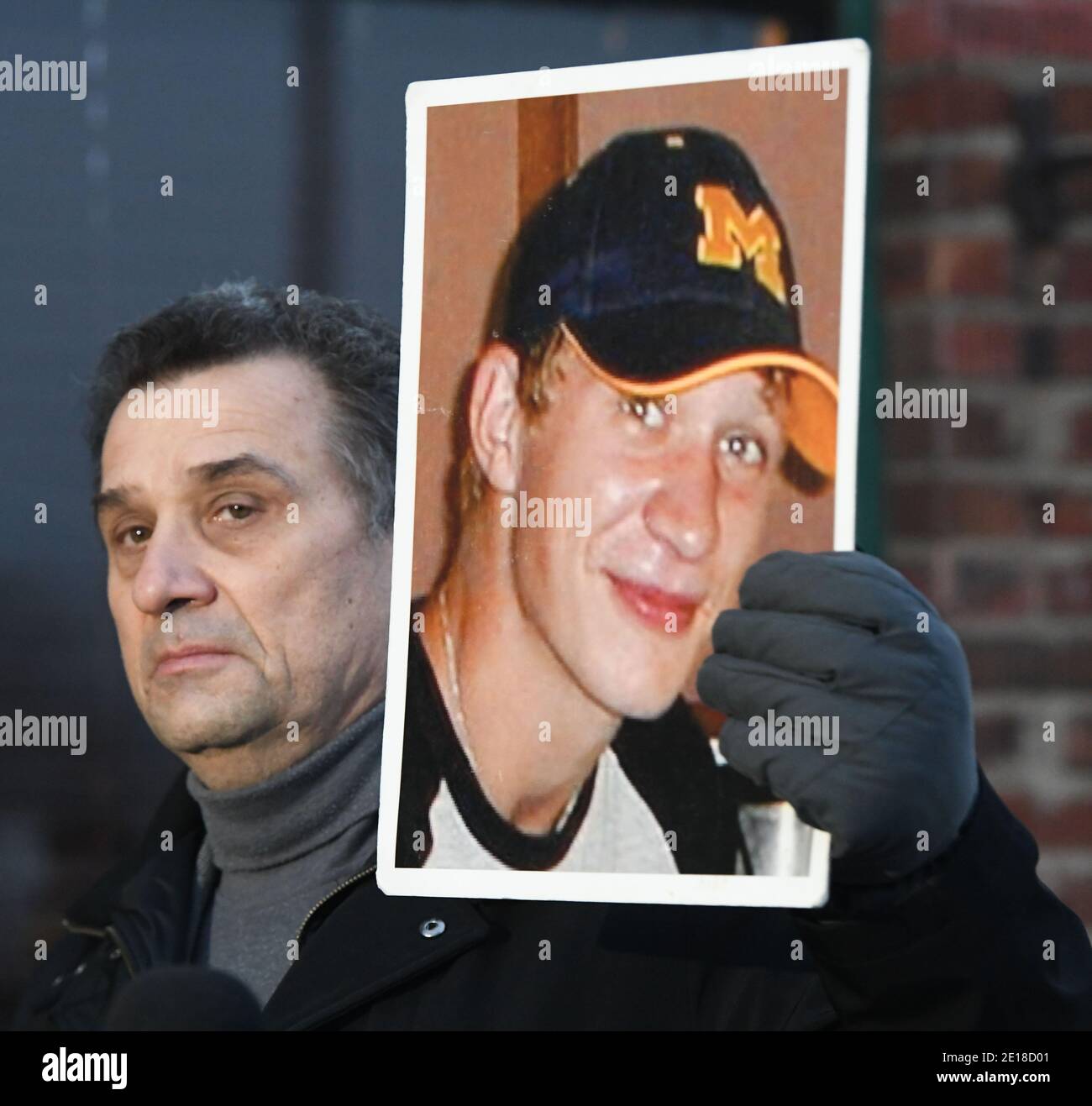 Kenosha, Wisconsin, USA. 4th Jan, 2021. MICHAEL BELL holds up a picture ...
