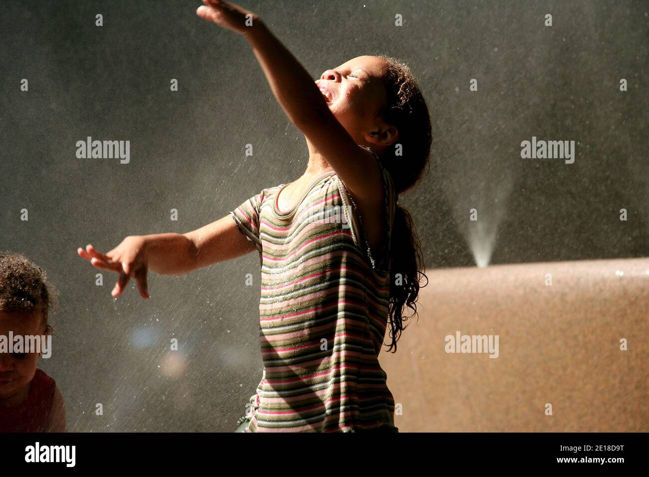 New York, NY, USA. 8 August, 2006. Young girl playing in playground ...