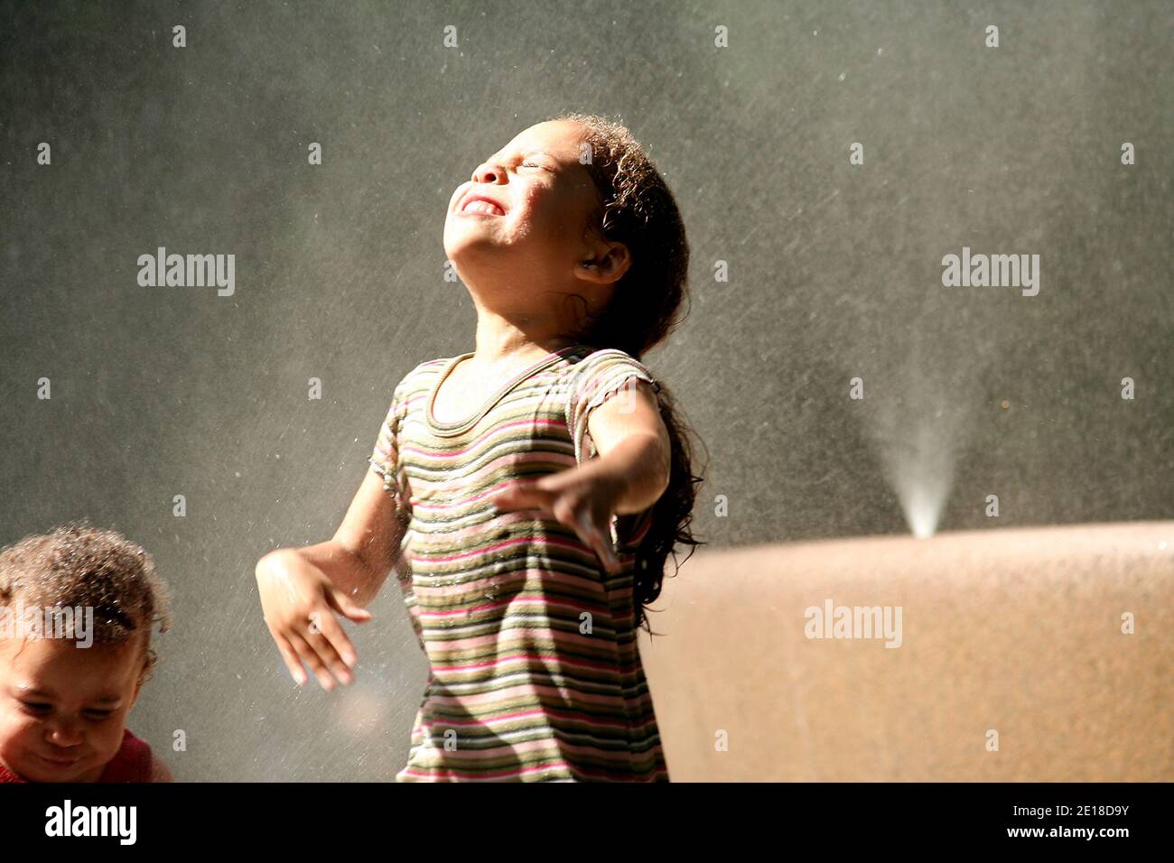 New York, NY, USA. 8 August, 2006. Young girl playing in playground ...