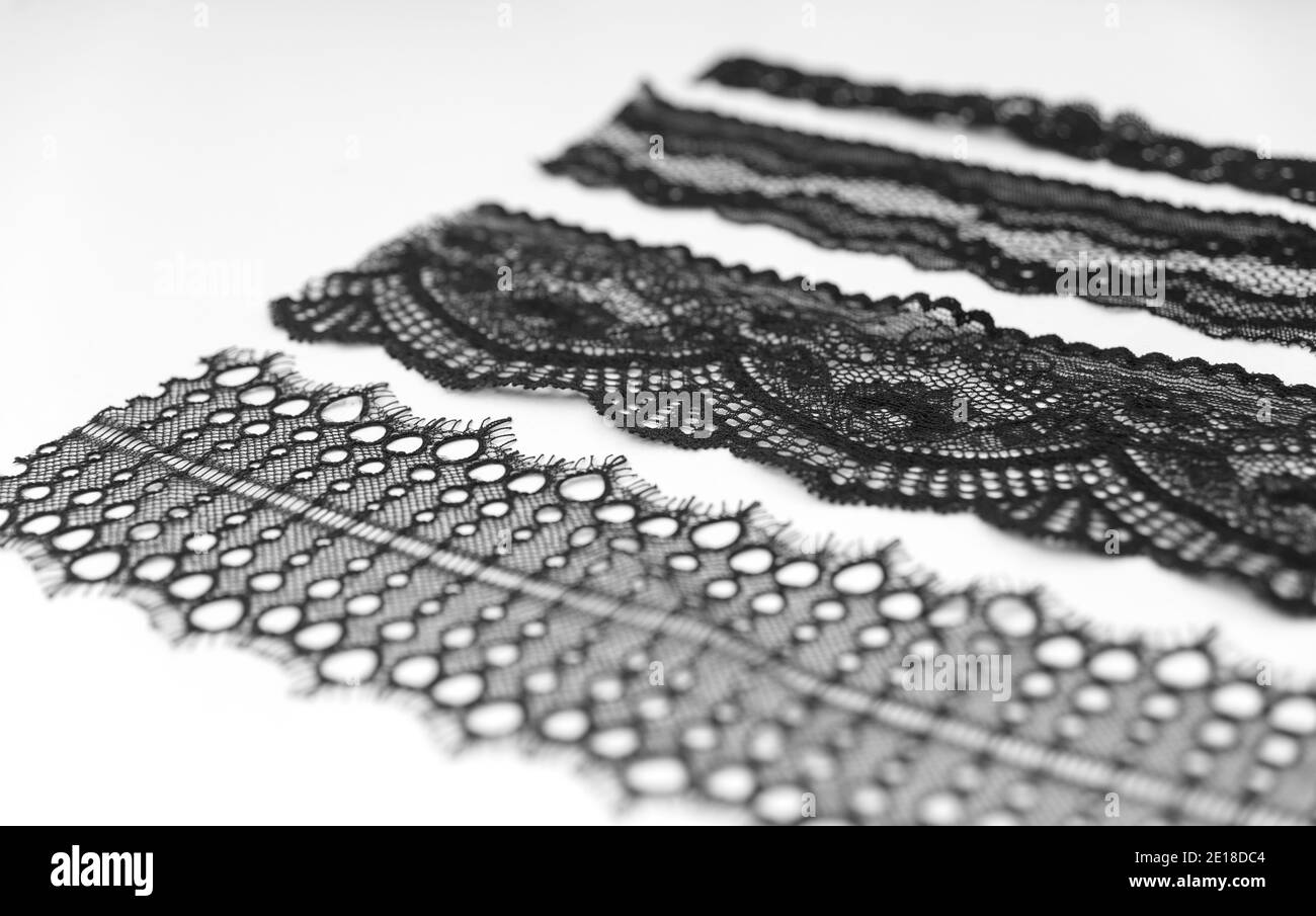 No brand black color lace samples on white background Stock Photo - Alamy