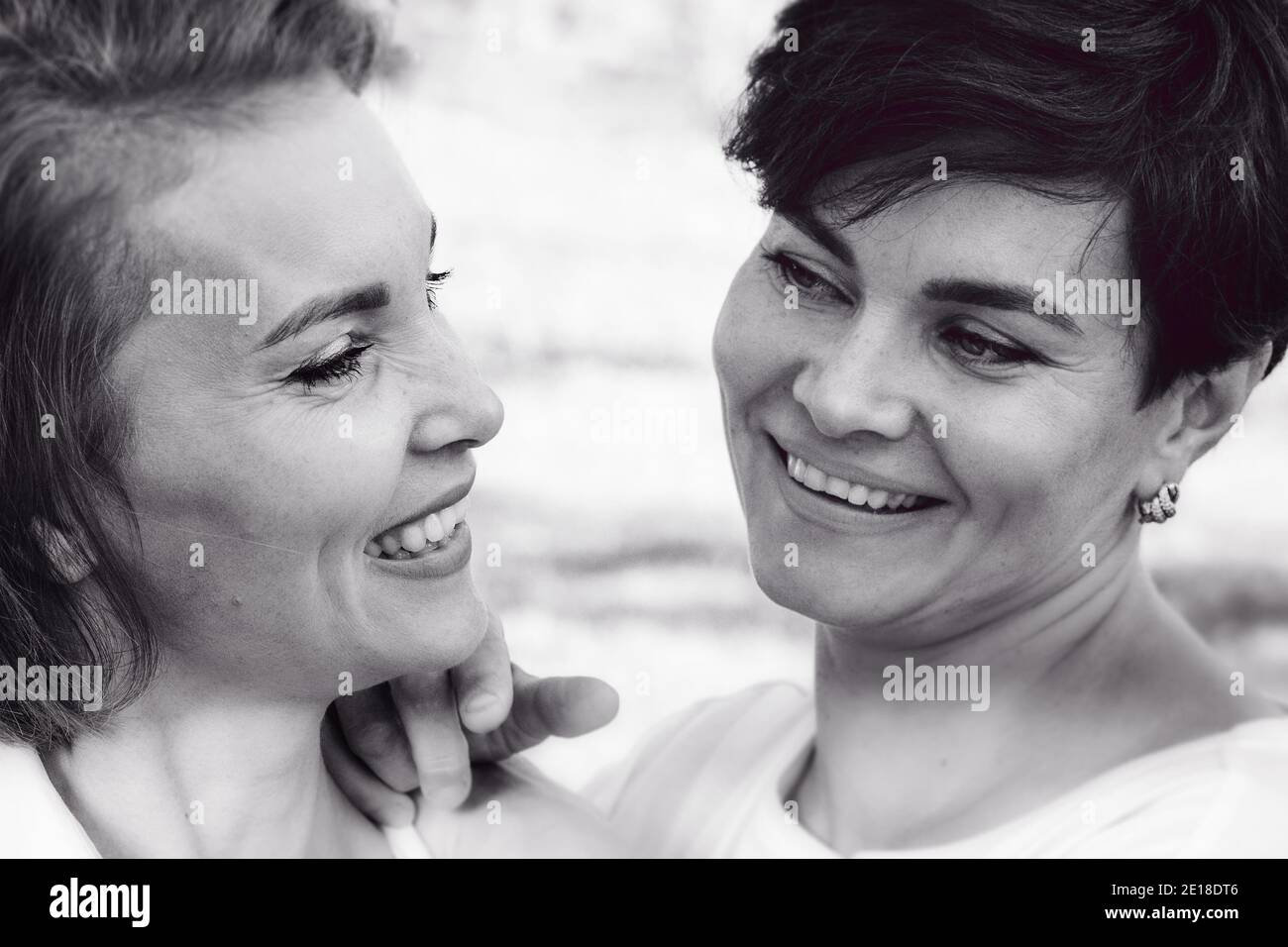 Warm female friendship and mutual understanding. The two women embrace ...