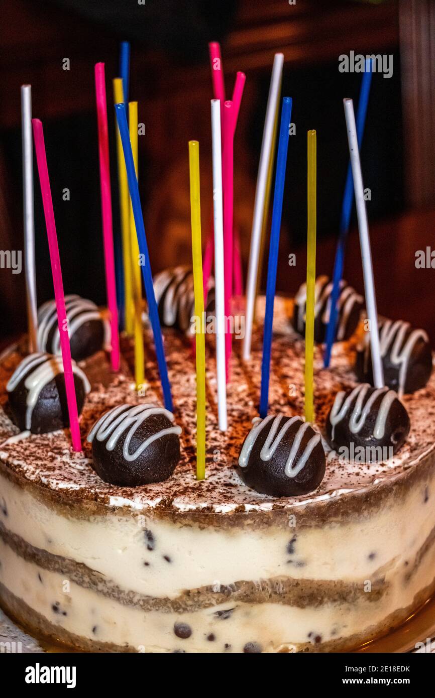Birthday celebration cake closeup with long colorful candles Stock ...
