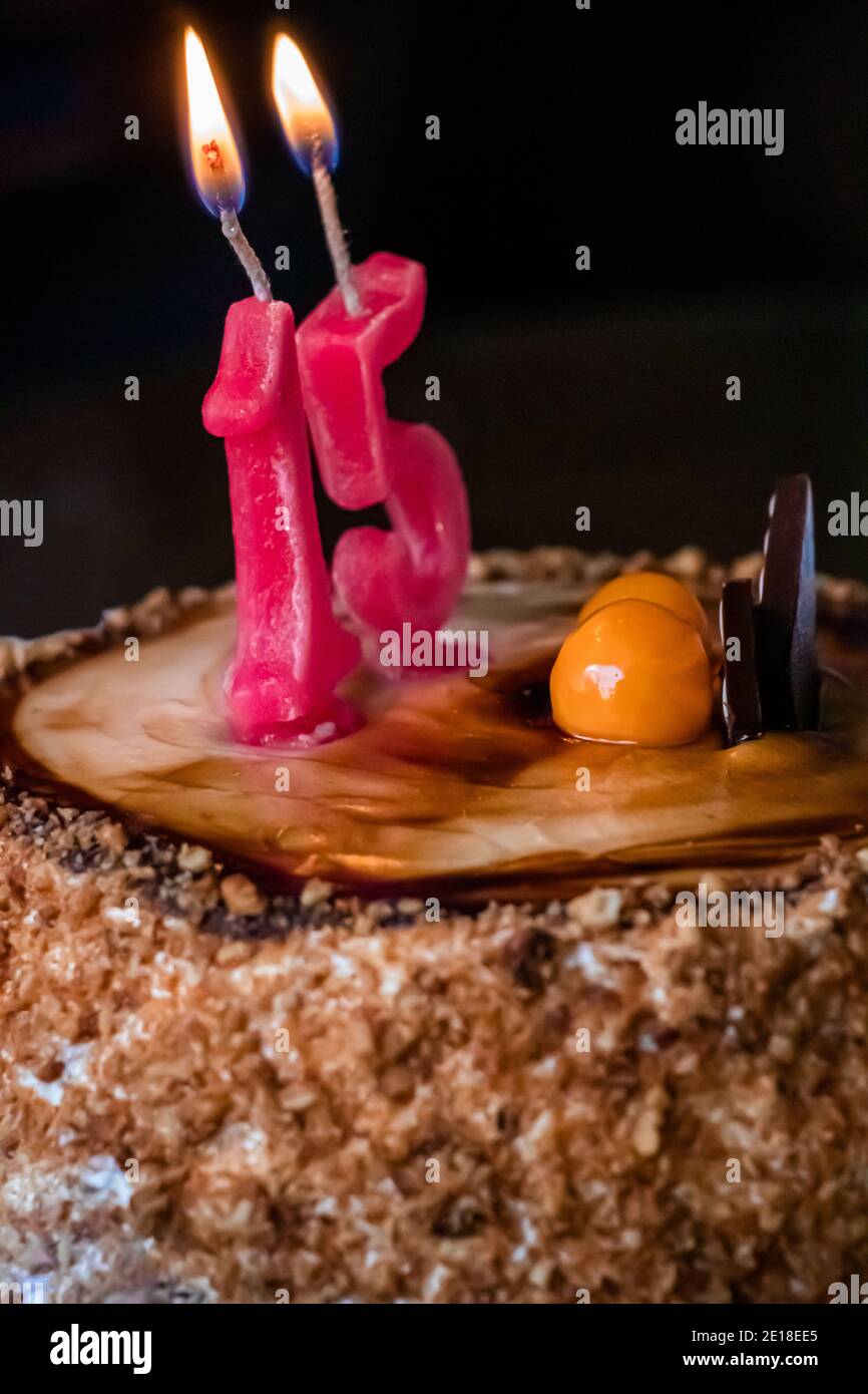 15th Birthday celebration cake closeup, with number 15 candles Stock ...