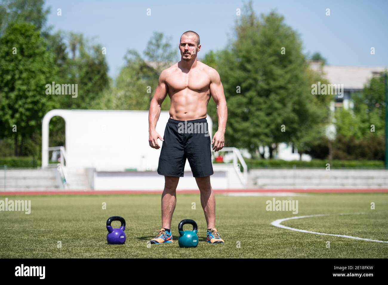 Man Working Out With Kettle Bell Outdoors - Bodybuilder Doing Heavy ...