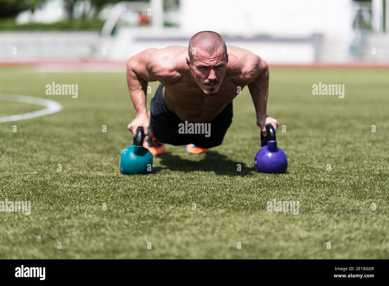 Healthy Man Athlete Doing Pushups Workout With Kettle Bell Outdoor ...
