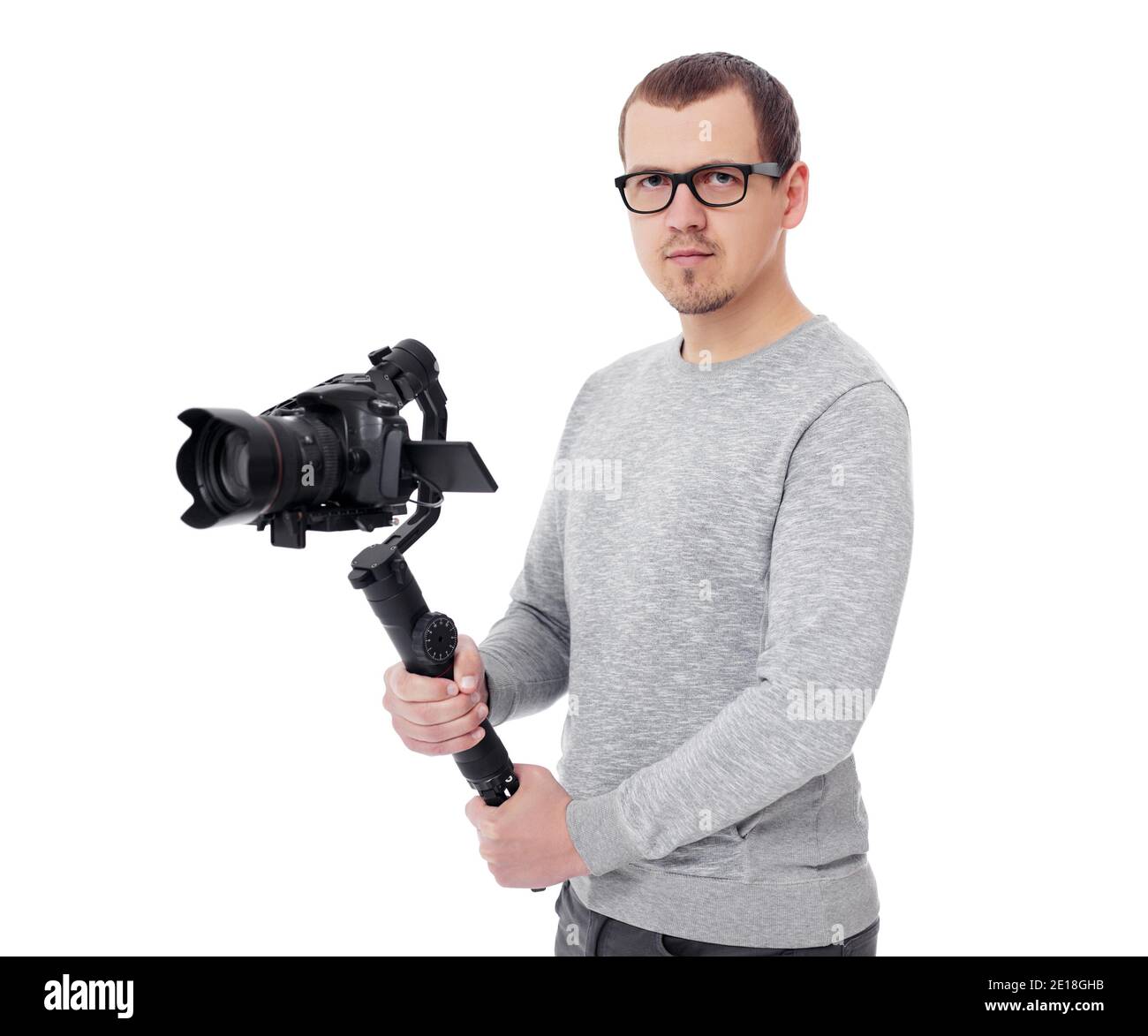 portrait of professional videographer using camera on gimbal stabilizer ...