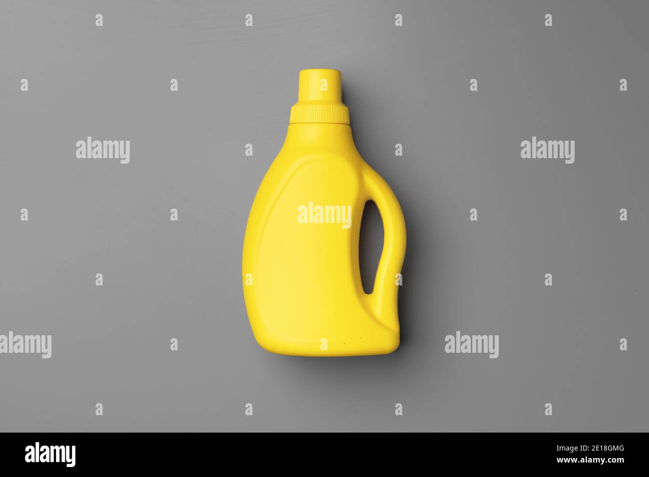 Yellow liquid detergents containers on gray background Stock Photo - Alamy