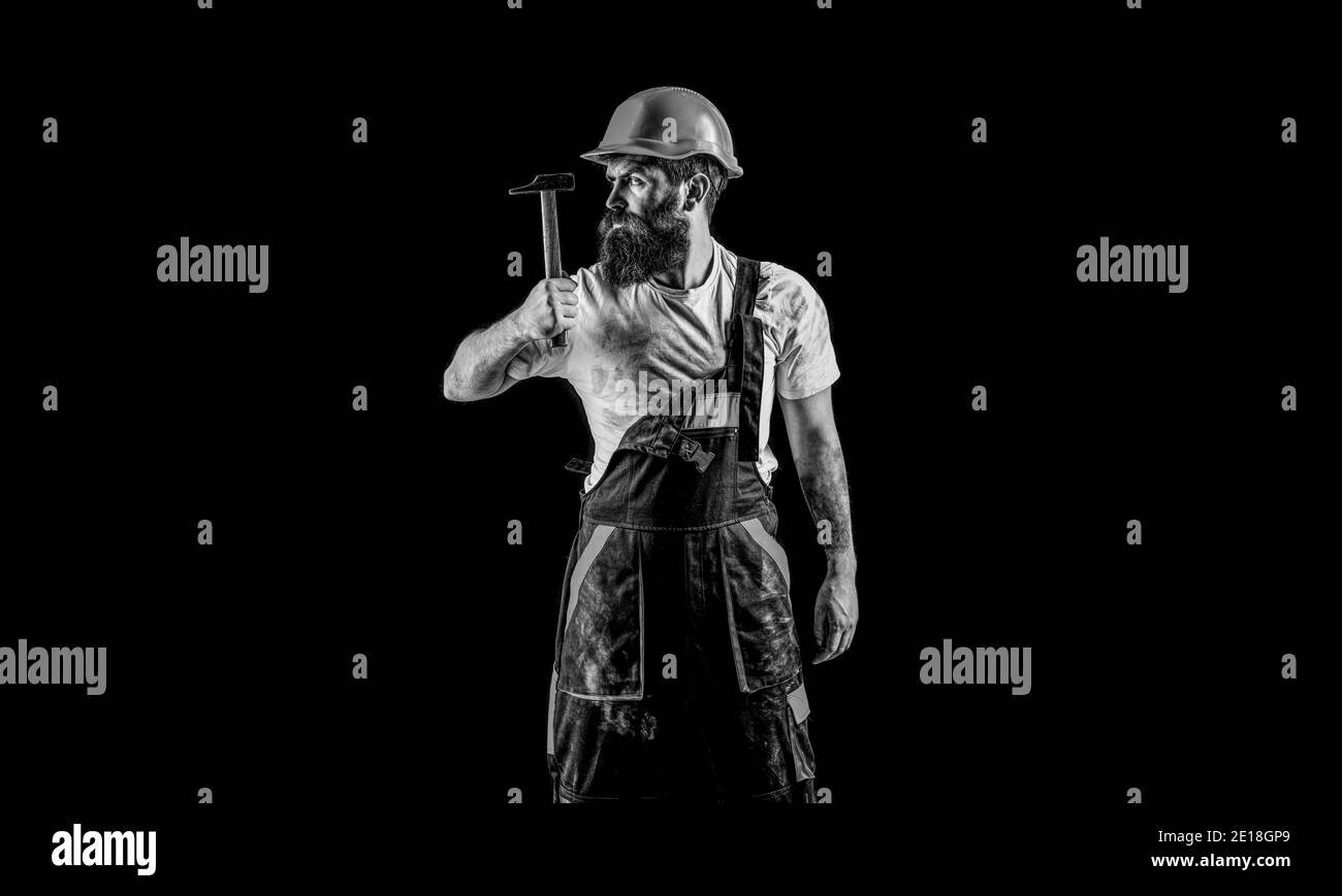Bearded builder isolated on black background. Bearded man worker with ...