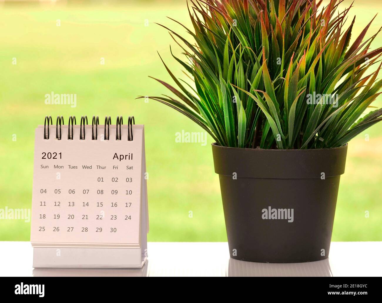White April 2021 calendar with green backgrounds and potted plant Stock ...