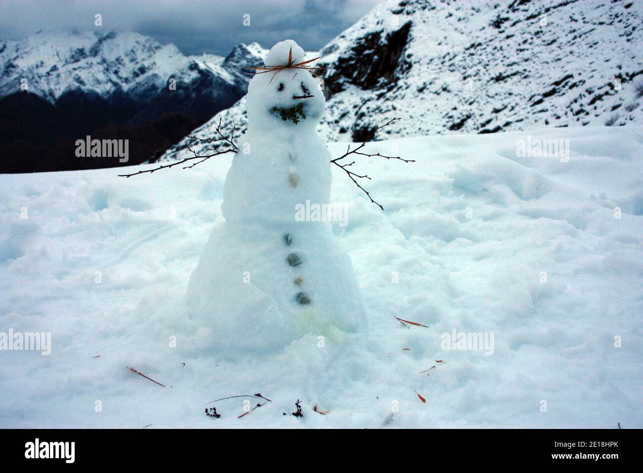 cute snowman on top of a white snowy mountain with winter landscape ...