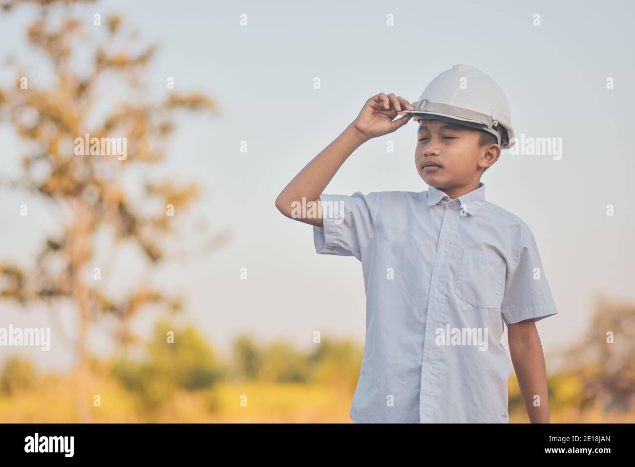 Boy kid white helmet dream future engineering concept Stock Photo - Alamy