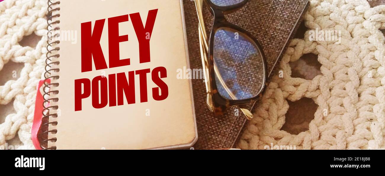 text KEY POINTs on the cover of a book, eye glasses and pen. Business ...