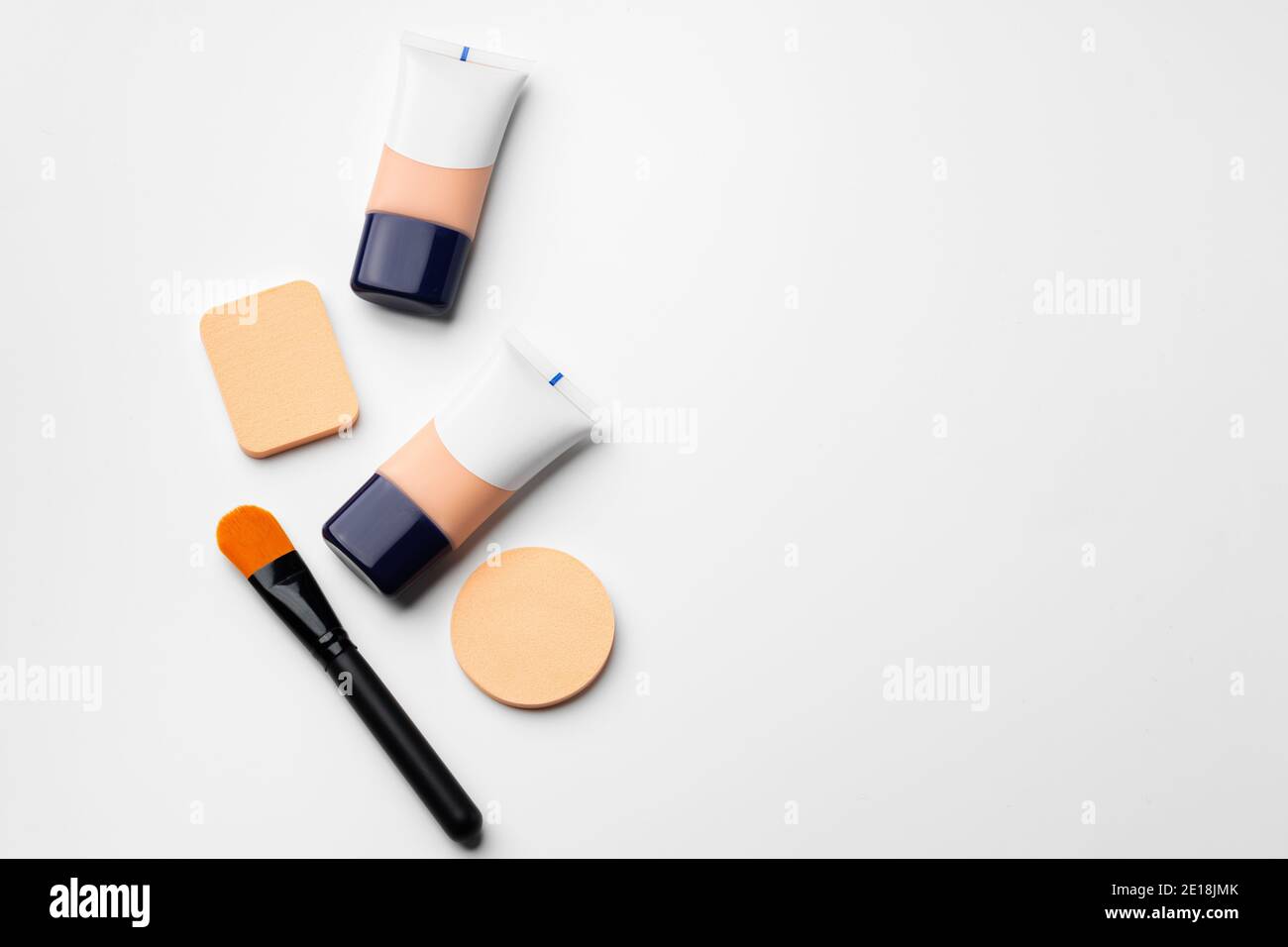 Make up liquid foundation with brush on white background Stock Photo ...