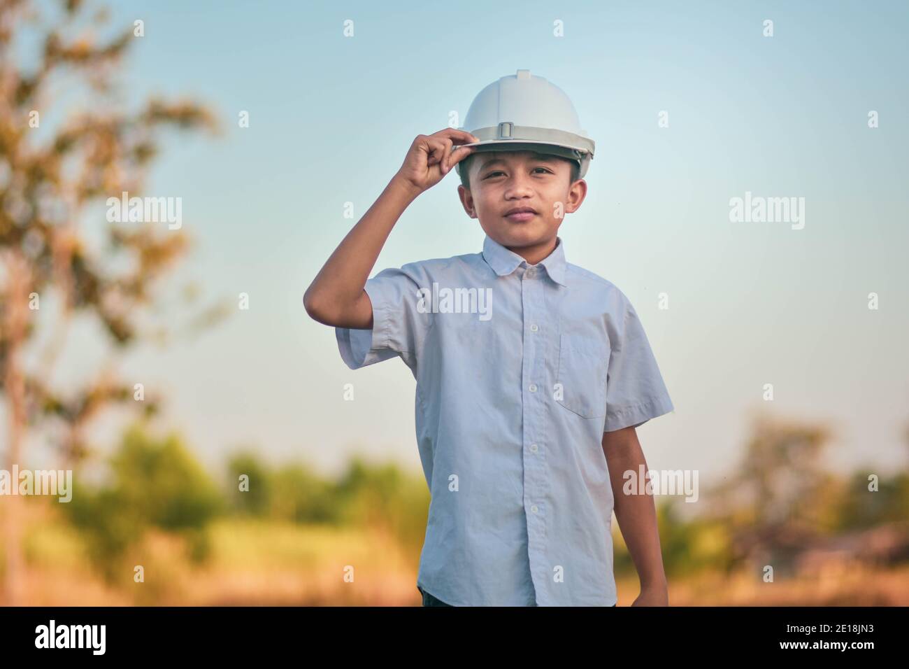 Boy Kid Engineer holding helmet Dream to Engineering future concept ...