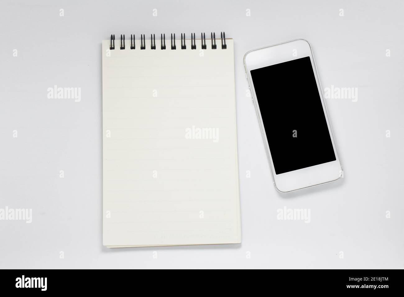 Mobile smart phone and White paper note on white background Stock Photo ...