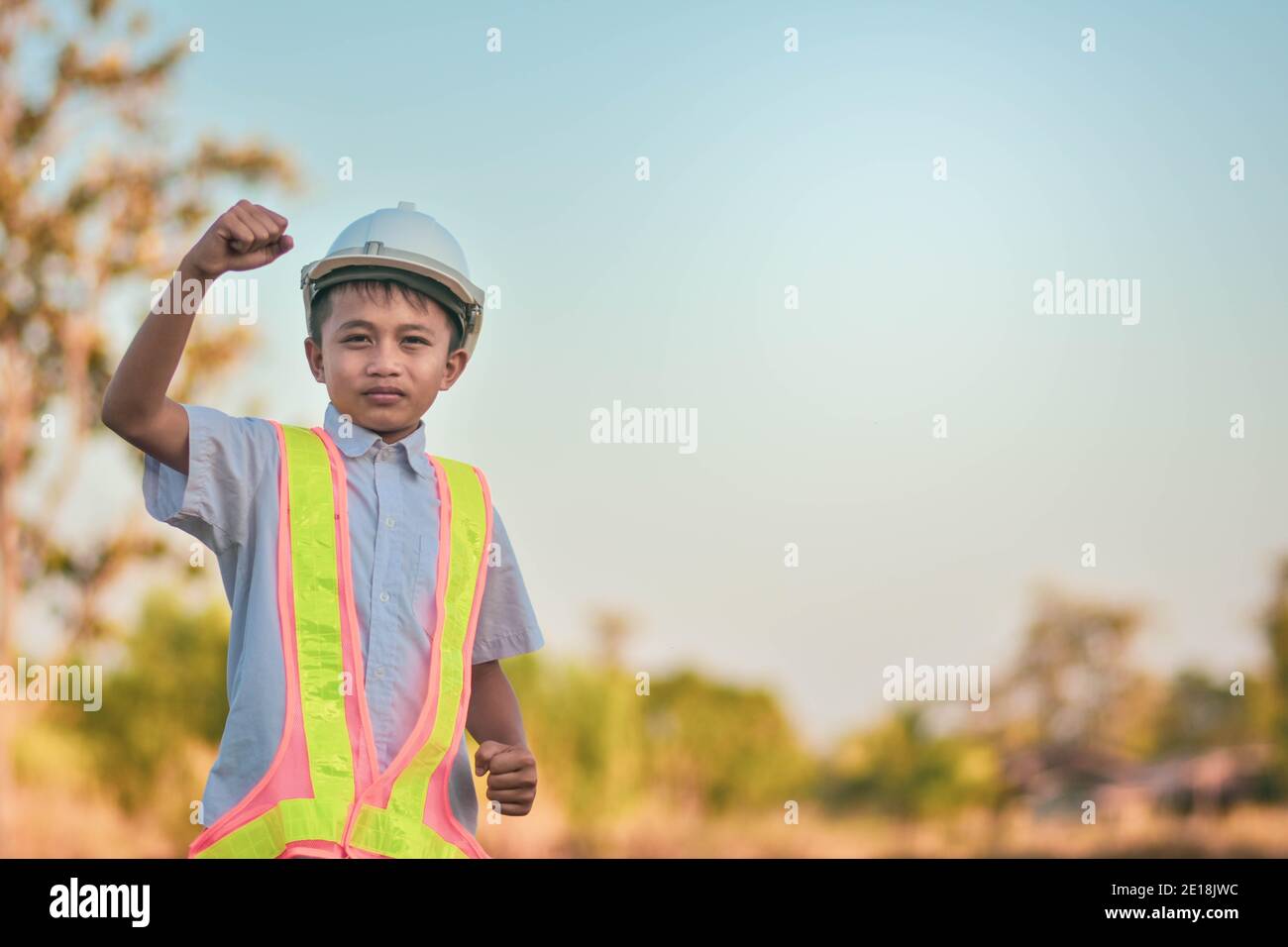 Boy kid Engineer standing outdoor holding hand success concept Stock ...