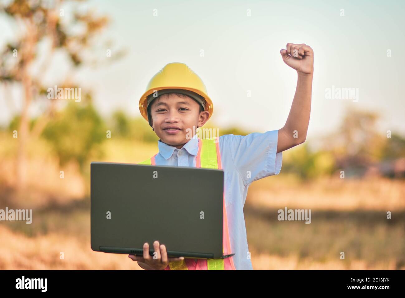 Boy kid Engineer holding laptop notebook holding hand success Stock ...