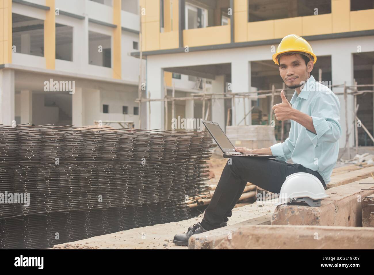 Engineering construction holding computer notebook inspection work at ...