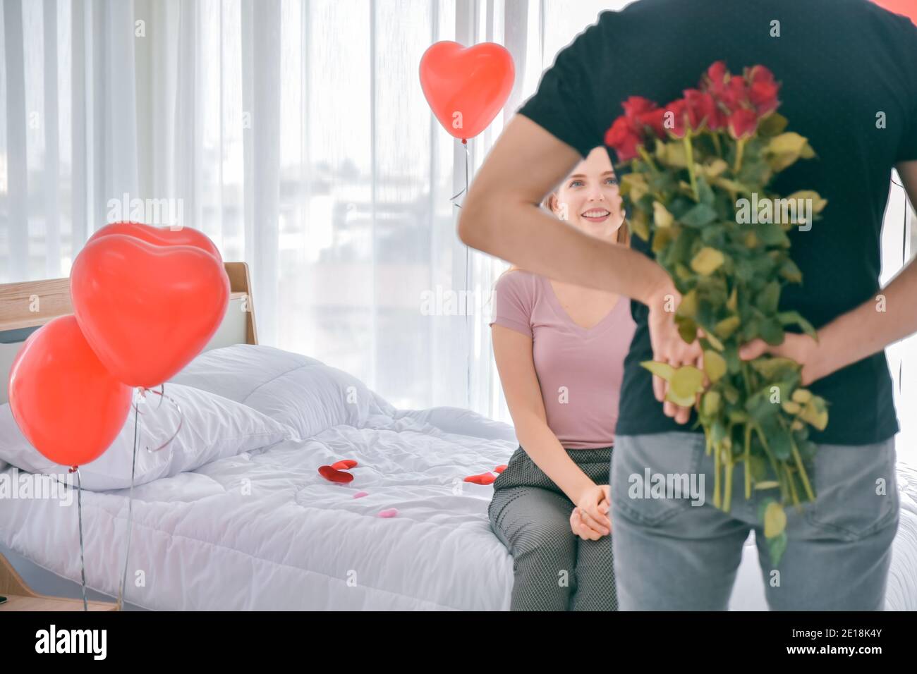 Couple surprise Rose flower in bed room morning Valentine's day Stock Photo - Alamy