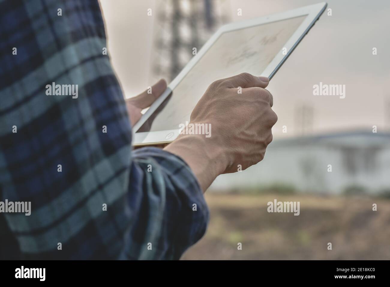 Close up Construction Engineering holding tablet building estate ...