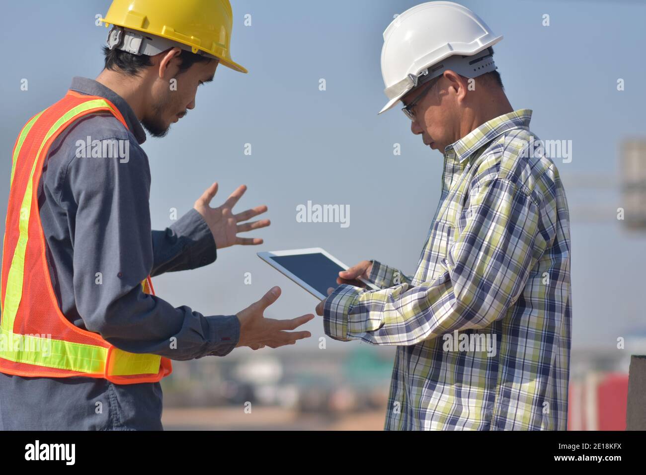 Construction Engineering use white tablet application working building ...