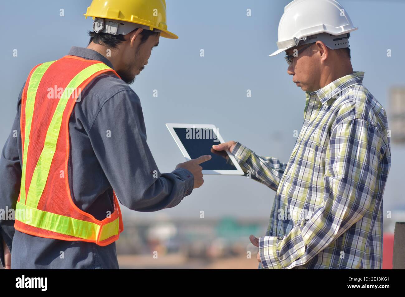 Construction Engineering use white tablet application working building ...