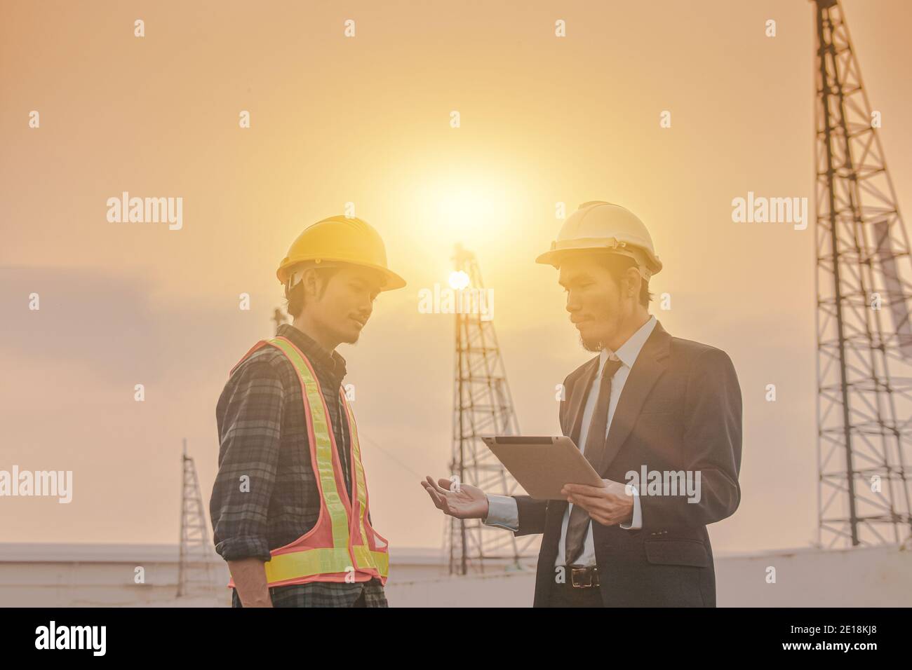 Project manager and Engineer standing communication at workplace ...