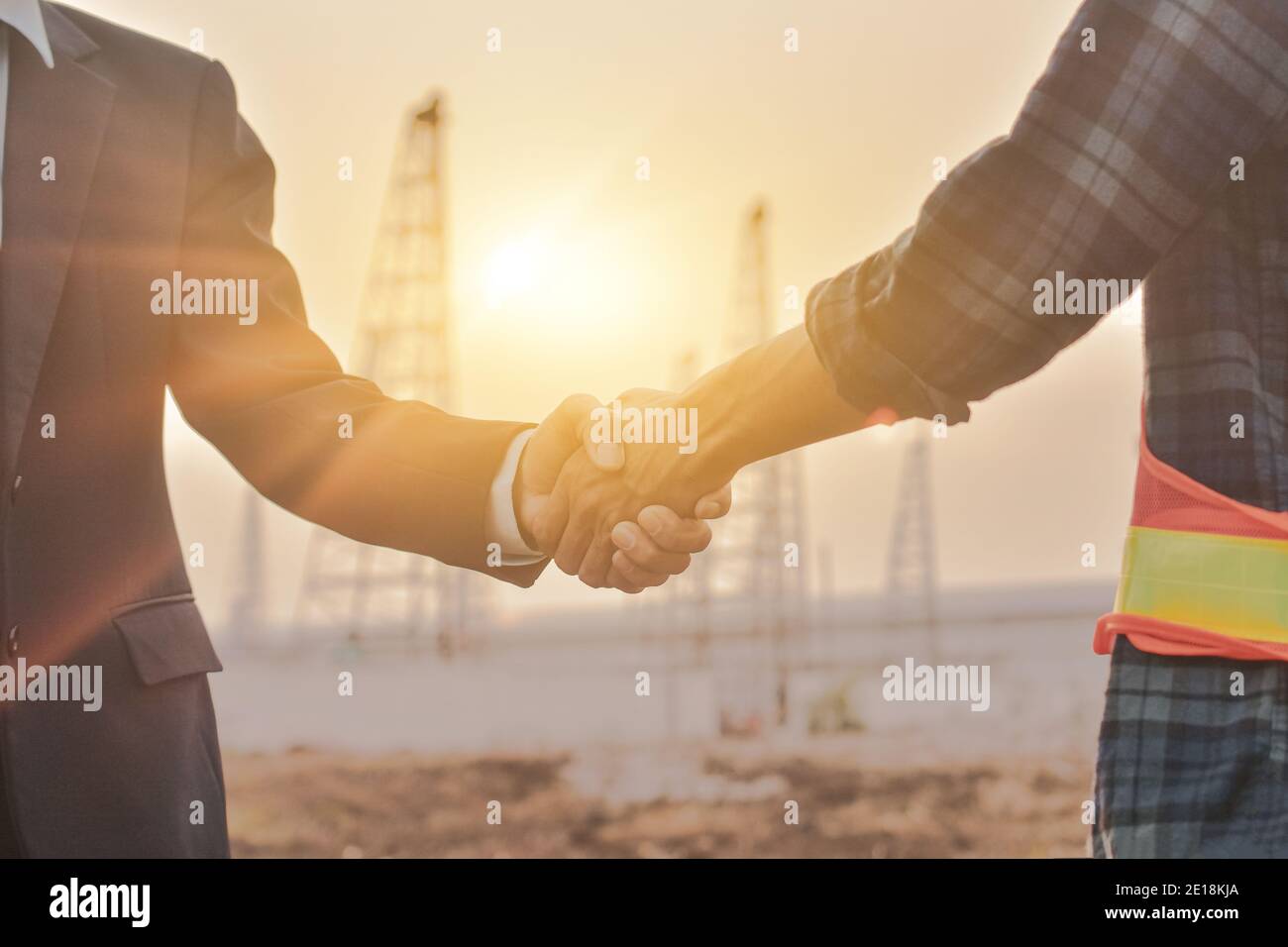 Engineering shake hand sunlight background Stock Photo - Alamy