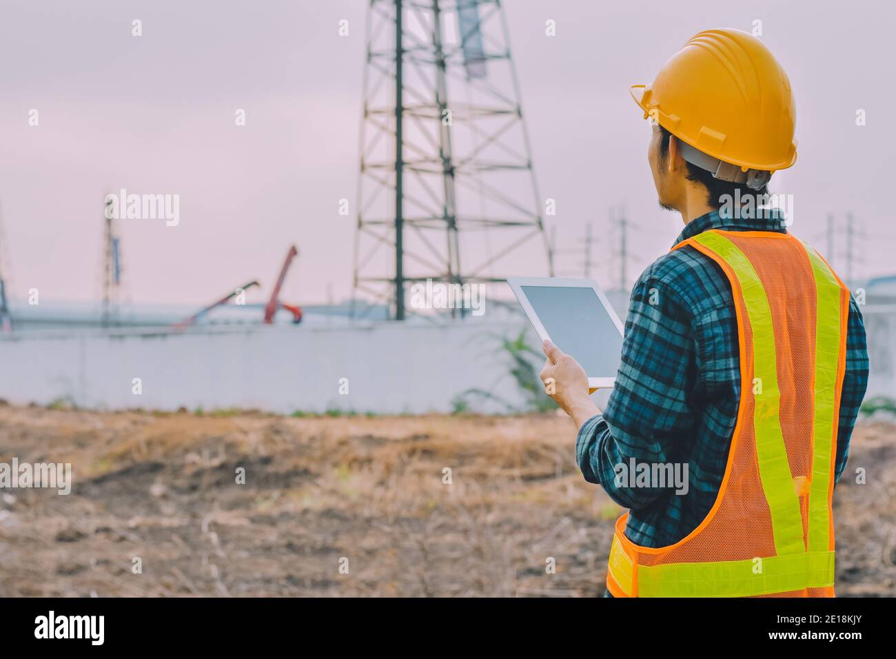 Engineer holding tablet working inspection building construction Stock ...