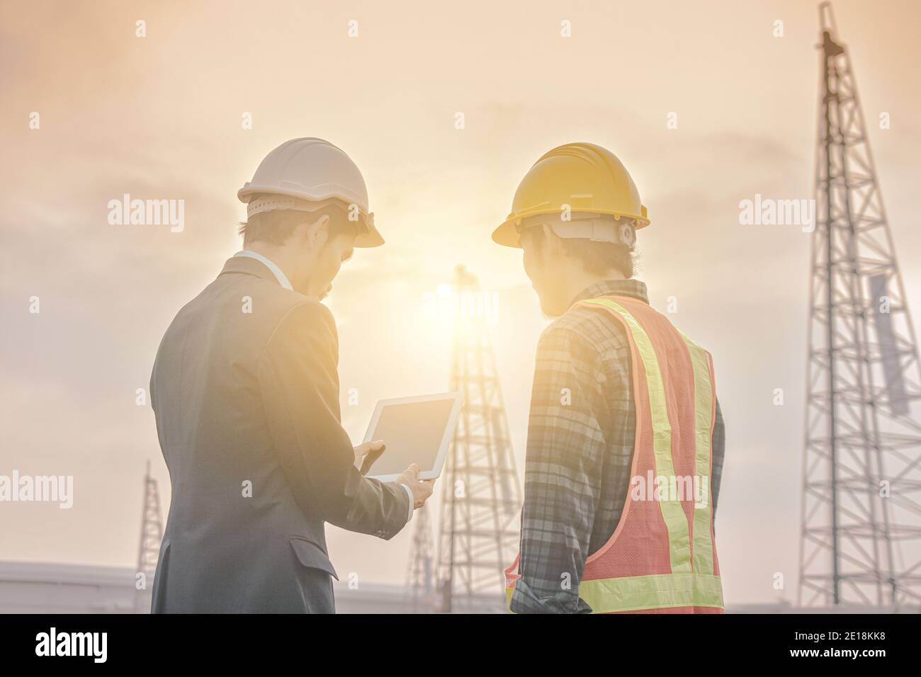 Project manager and Engineer standing communication at workplace ...