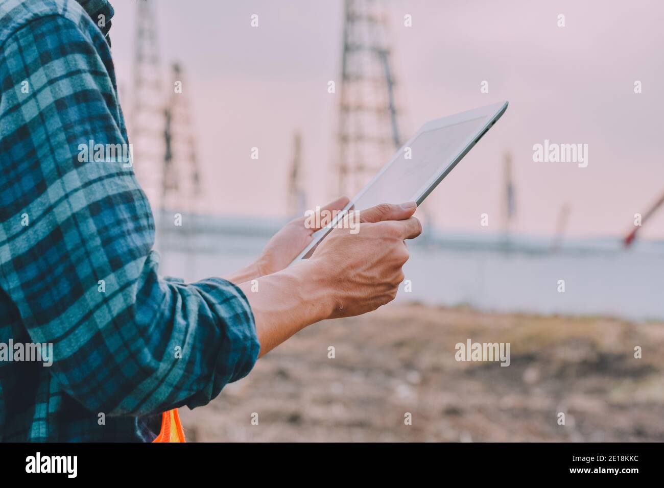 Engineer holding tablet working inspection building construction Stock ...