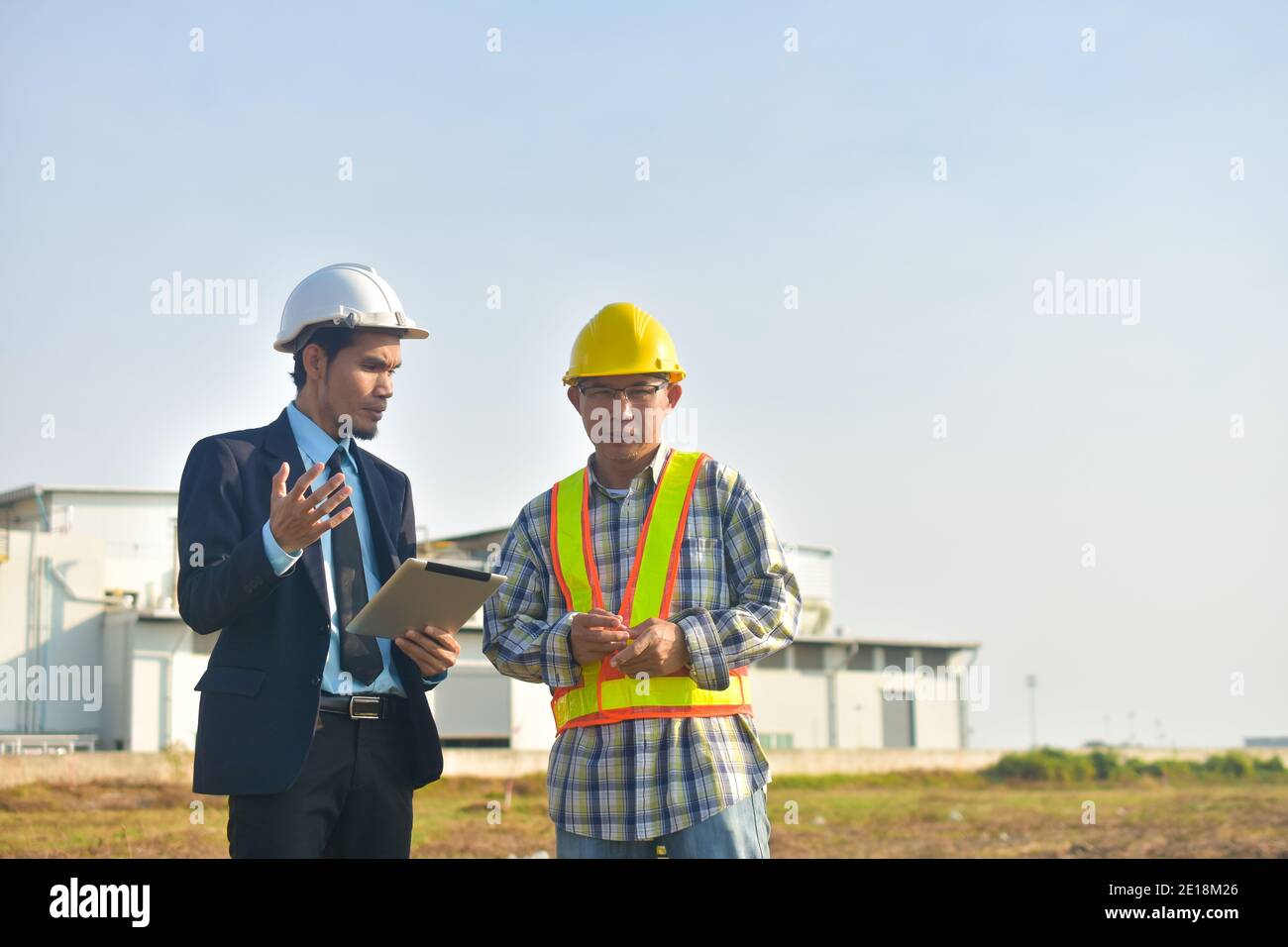 Project manager and Engineer communication use tablet factory ...