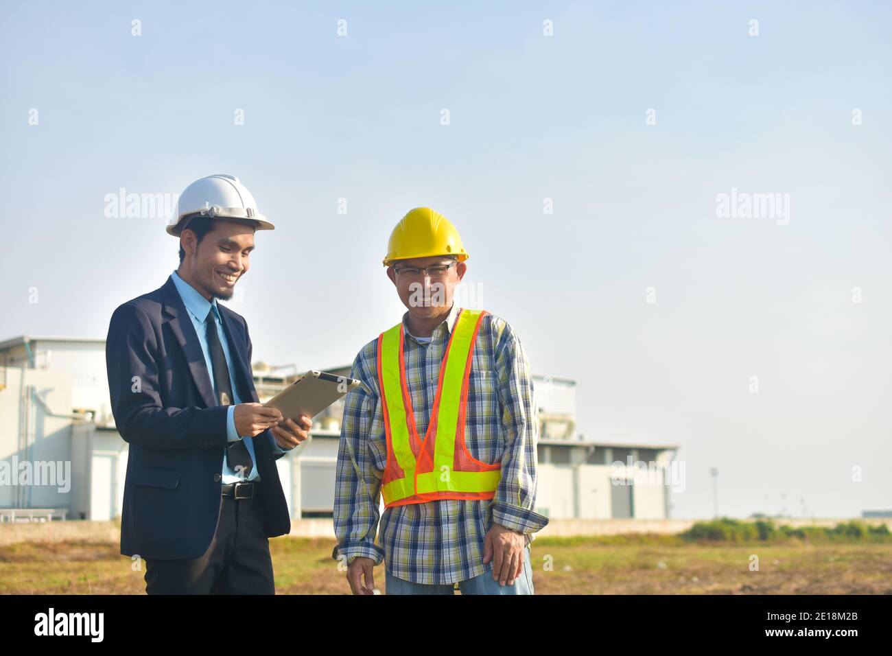 Project manager and Engineer communication use tablet factory ...